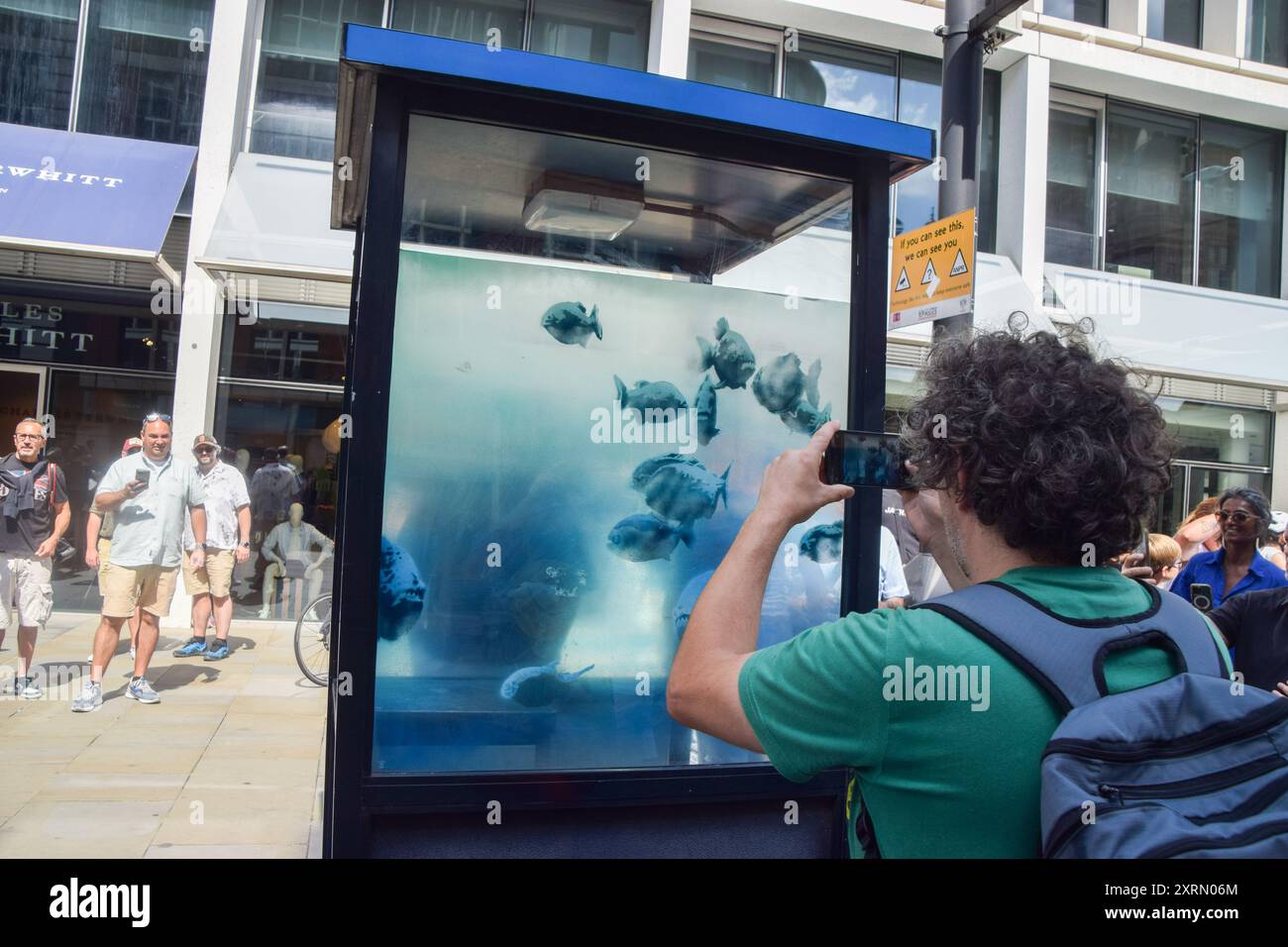 London, England, UK. 11th Aug, 2024. A man takes photos of the new ...