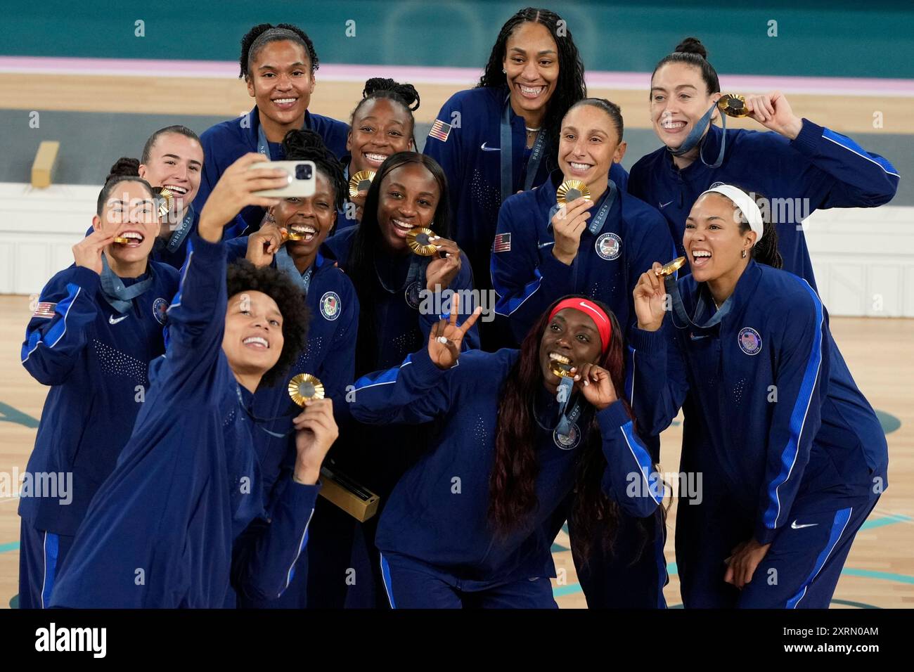 The United States team poses for a picture with their gold medals at ...