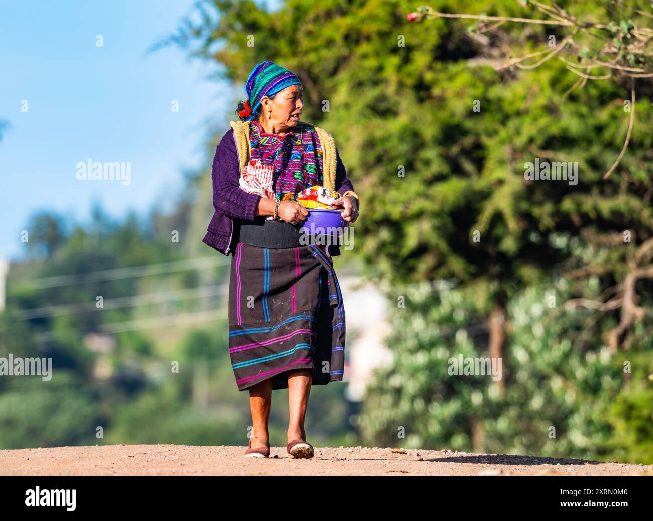 Indigenous Mayan Mam woman in colorful traditional hand weaved clothes ...