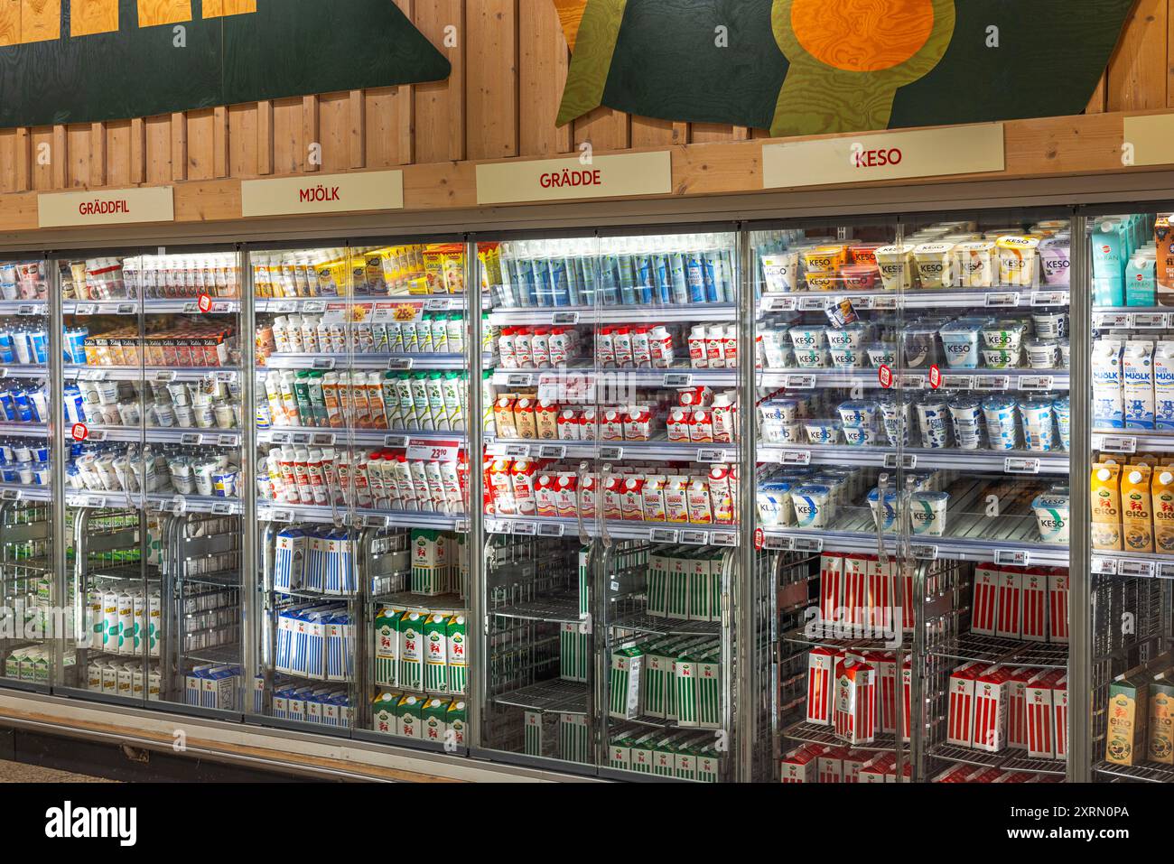 View of supermarket with refrigerated glass-door displays, showcasing ...