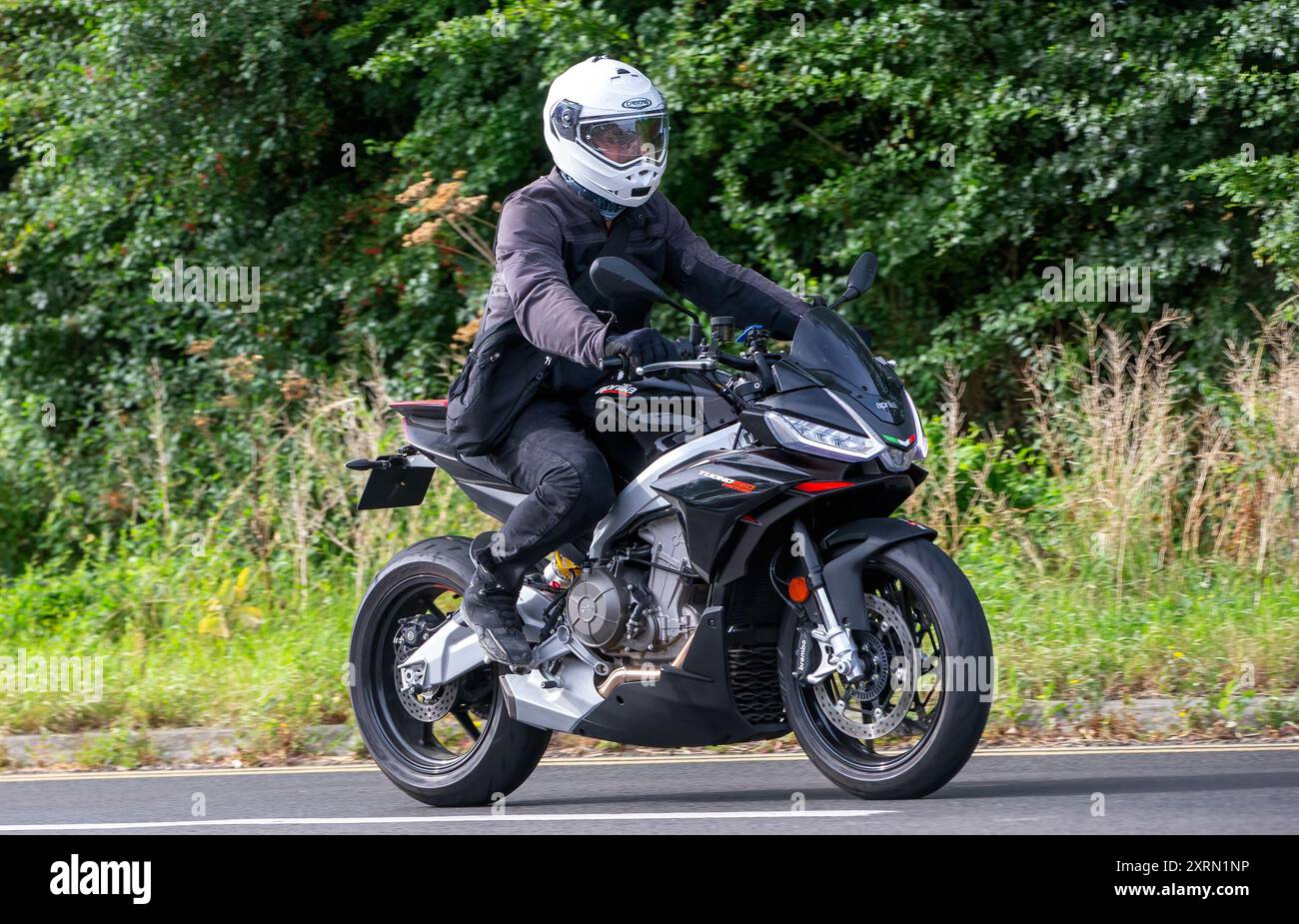 Potterspury,Northants,UK - Aug 11th 2024: Man riding a 2023 black ...
