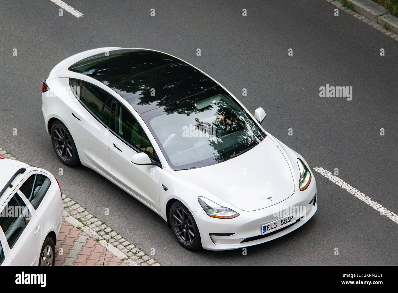 OSTRAVA, CZECH REPUBLIC - MAY 27, 2024: White Tesla Model 3 car with ...