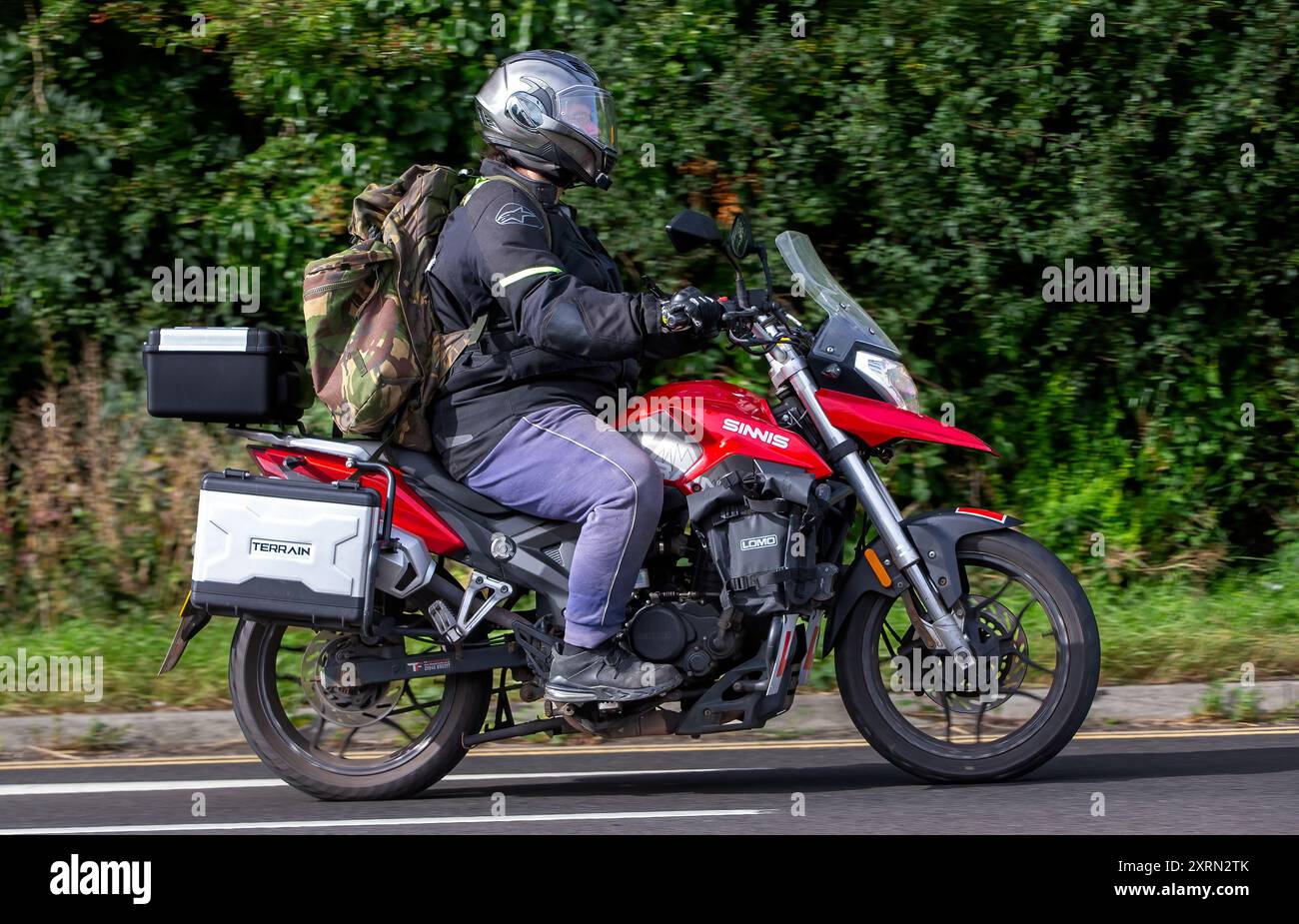 Potterspury,Northants,UK - Aug 11th 2024: Man riding a red 2021 Sinnis ...