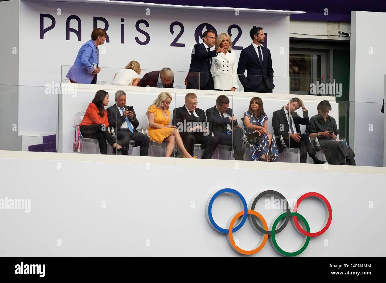 French President Emmanuel Macron talks to his wife Brigitte during the ...