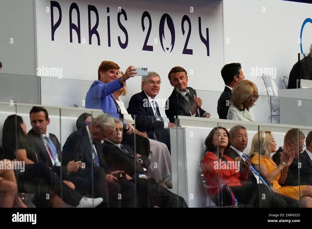 French President Emmanuel Macron poses for a selfie during the 2024 ...