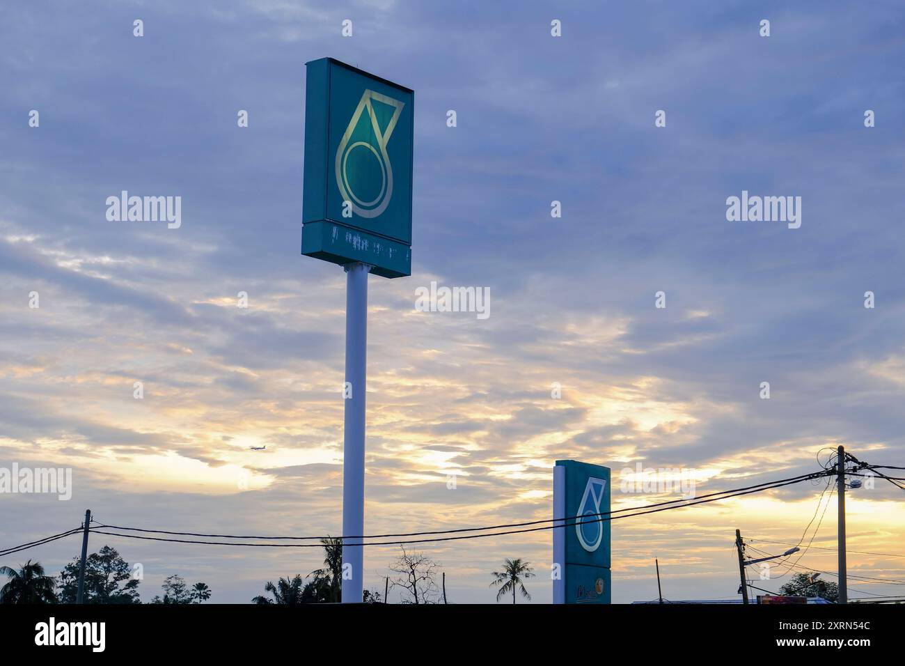 Petronas petrol station sign seen during sunset. Daily life photo of ...