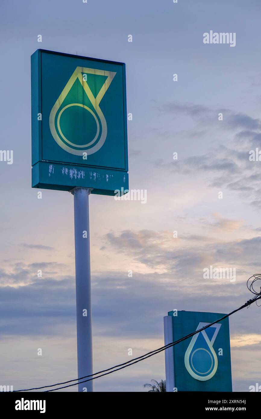 Petronas petrol station sign seen during sunset. Daily life photo of ...