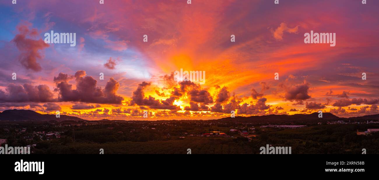 Aerial view of colorful sky at sunset while hints of gold radiate from ...