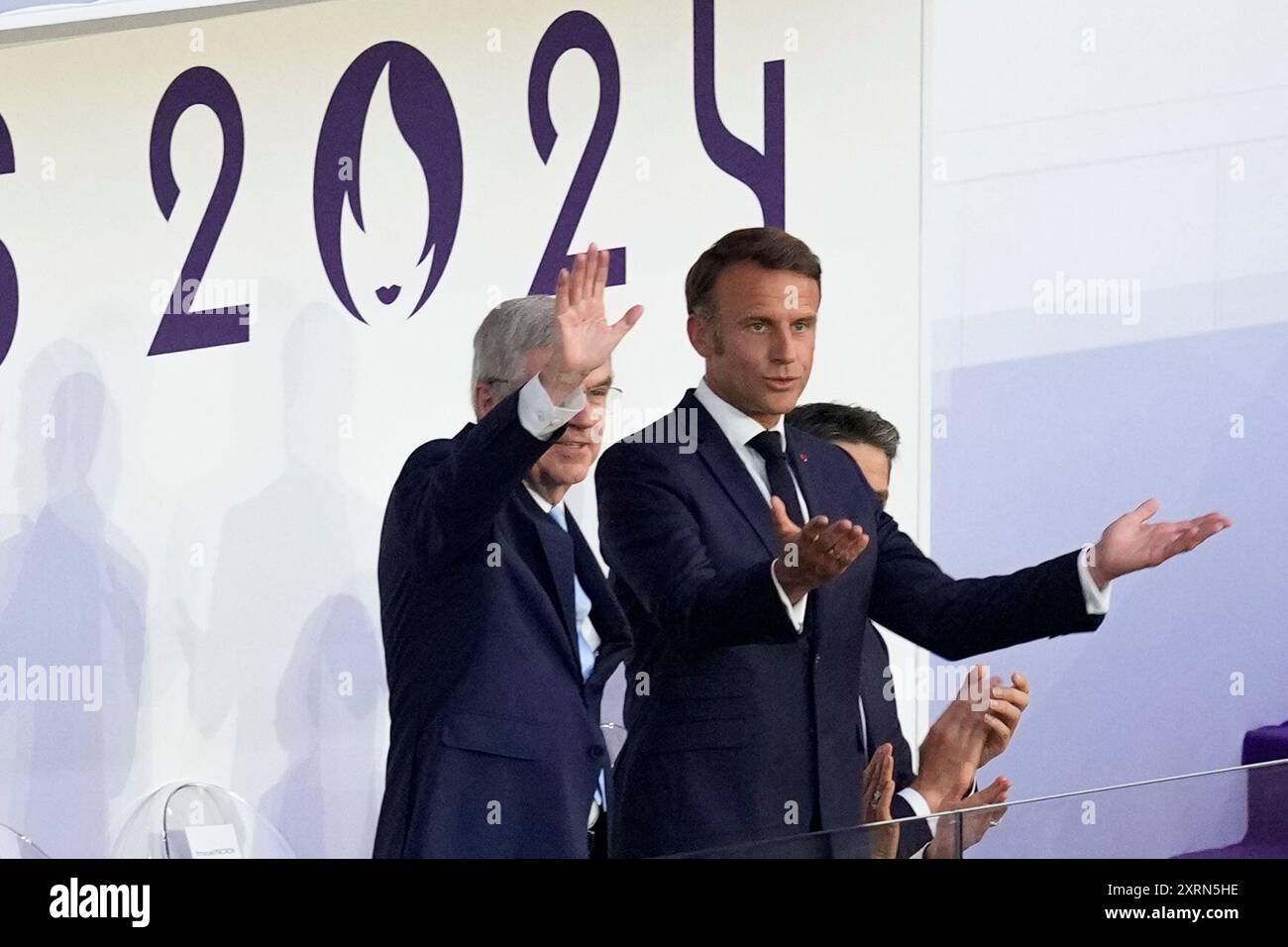 French President Emmanuel Macron, right, and IOC President Thomas Bach ...