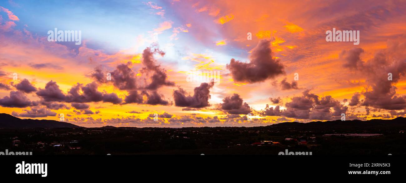 Aerial view of colorful sky at sunset while hints of gold radiate from ...