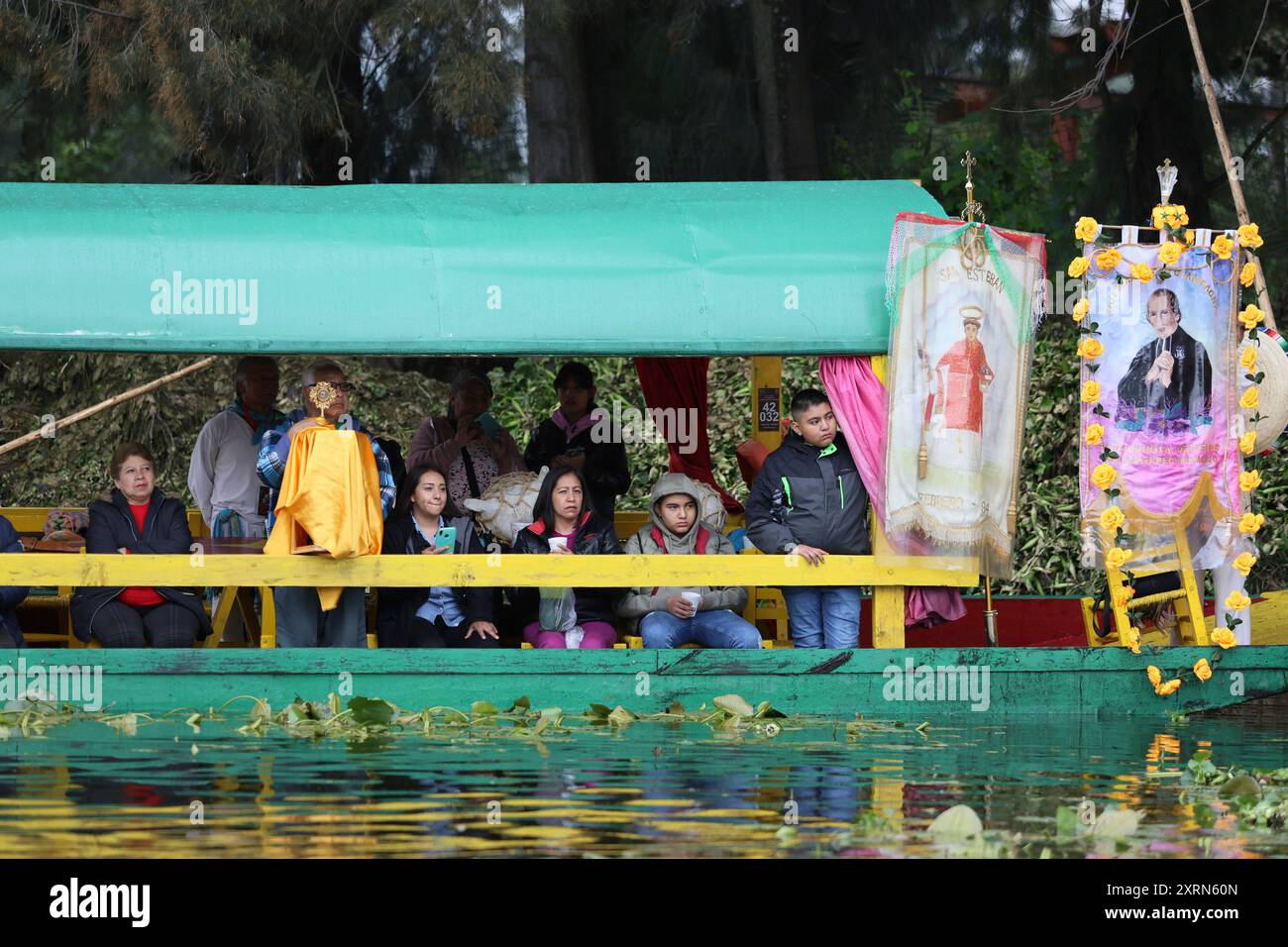 Devotees watch as a relic of St. Jude Thaddeus is transported in an urn ...