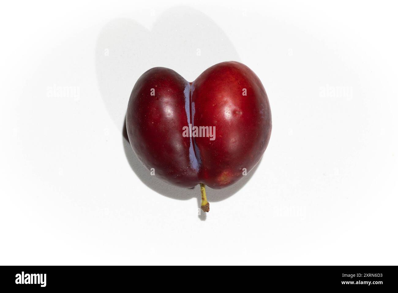 Two fruits in one on white background Stock Photo - Alamy