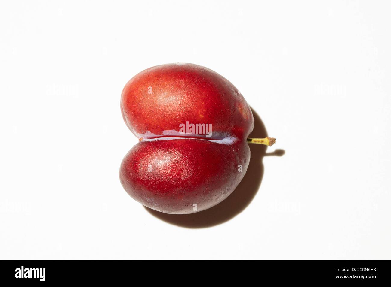 Two fruits in one on white background Stock Photo - Alamy