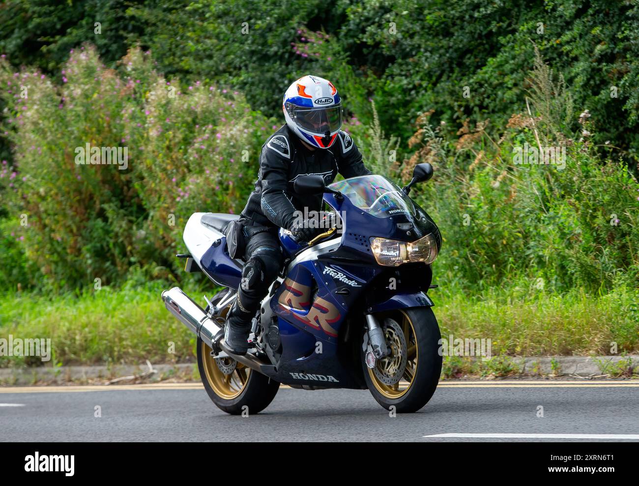 Potterspury,Northants,UK - Aug 11th 2024: Man riding a 1999 Honda ...