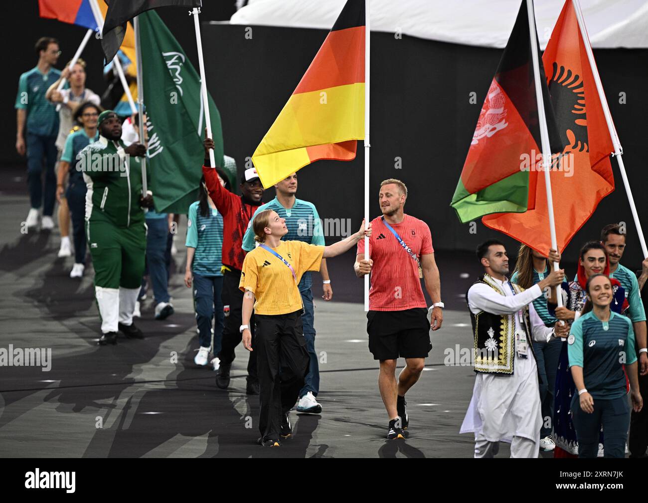 Paris, France. 11th Aug, 2024. German athlete holds the national flag ...