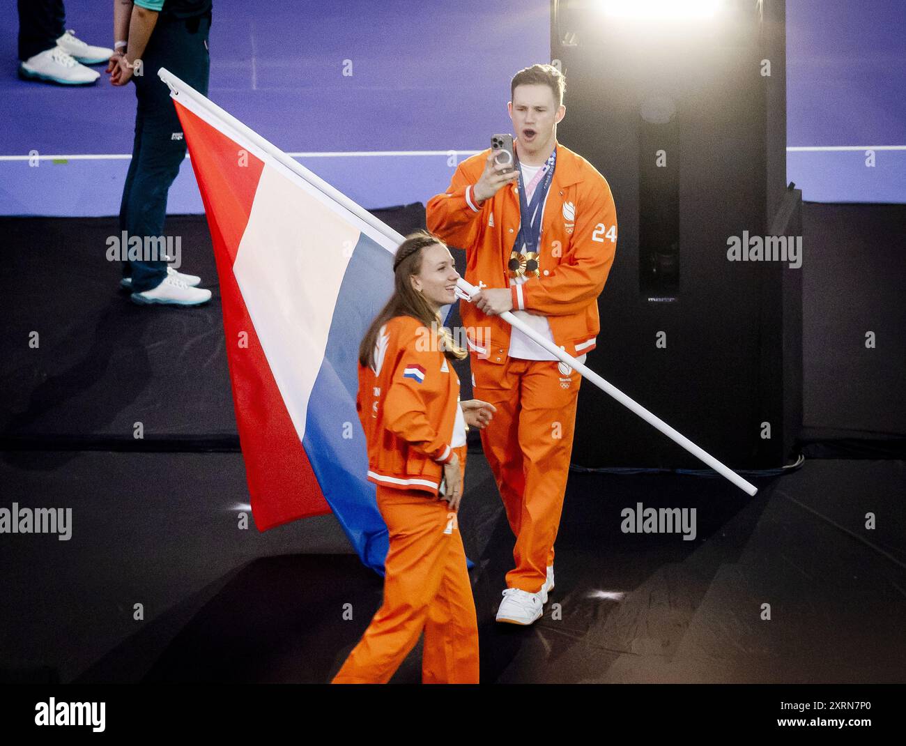 PARIS - Athlete Femke Bol and track cyclist Harrie Lavreysen carry the ...