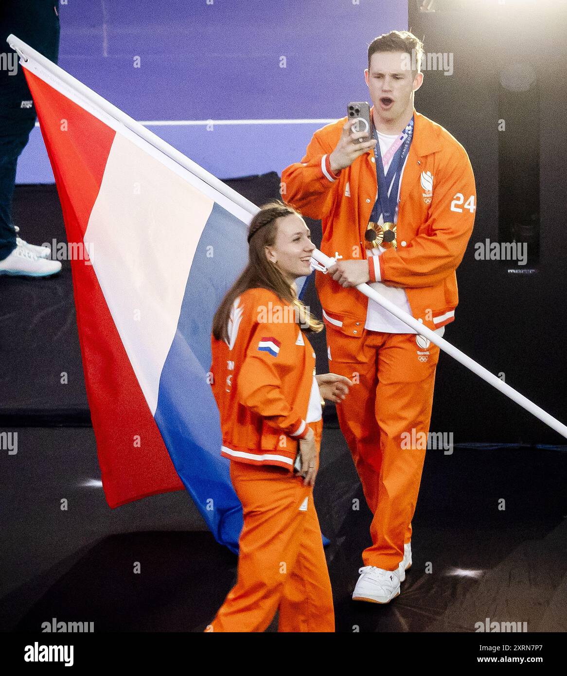 PARIS - Athlete Femke Bol and track cyclist Harrie Lavreysen carry the ...