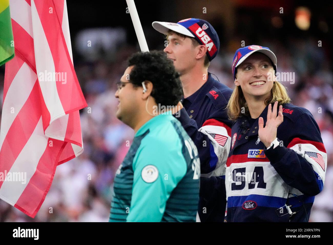 United States flag bearer's Katie Ledecky and Nick Mead walk into the ...
