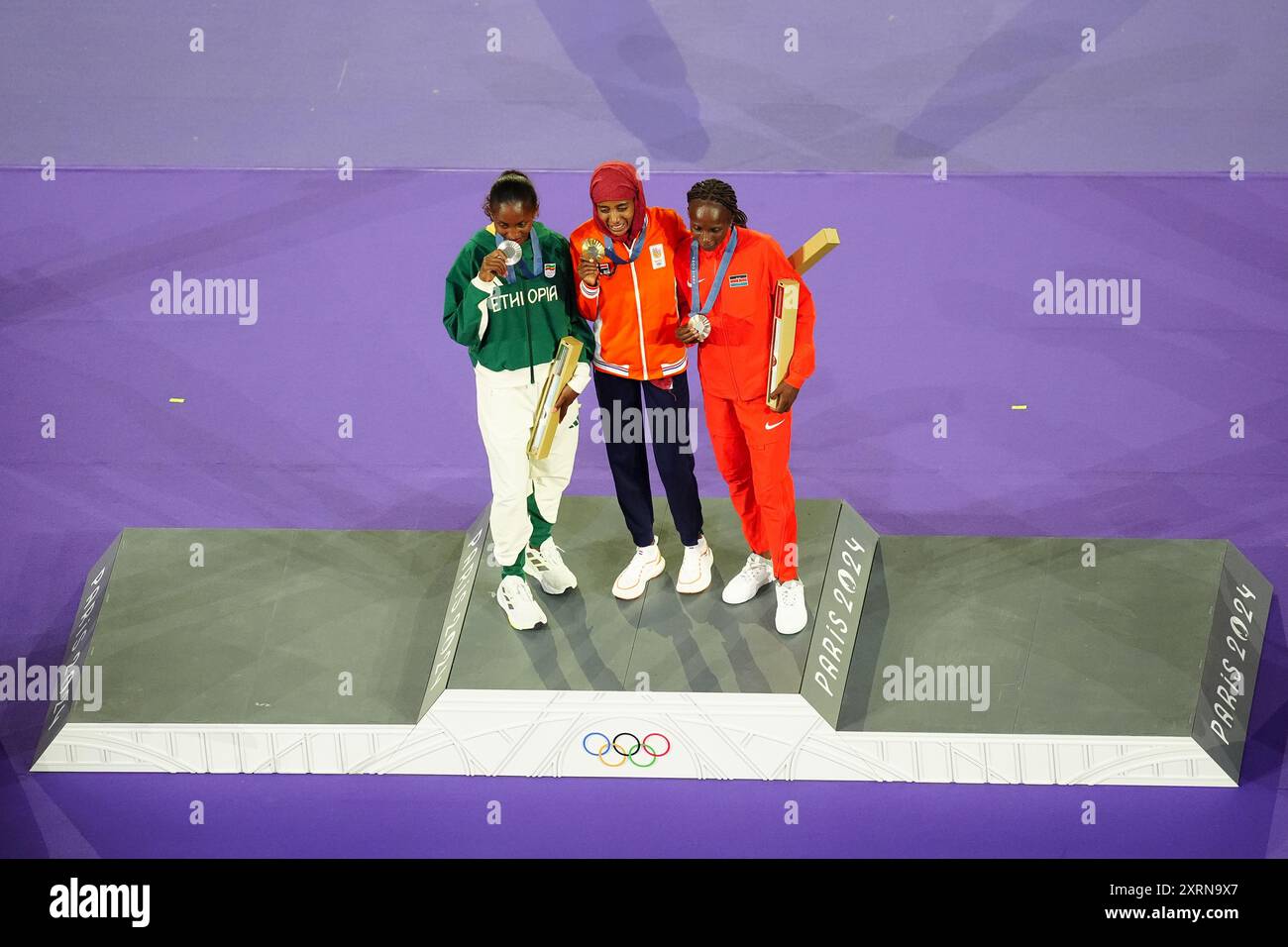 Netherlands' Sifan Hassan, gold medal winner (centre)Ethiopia's Tigst ...