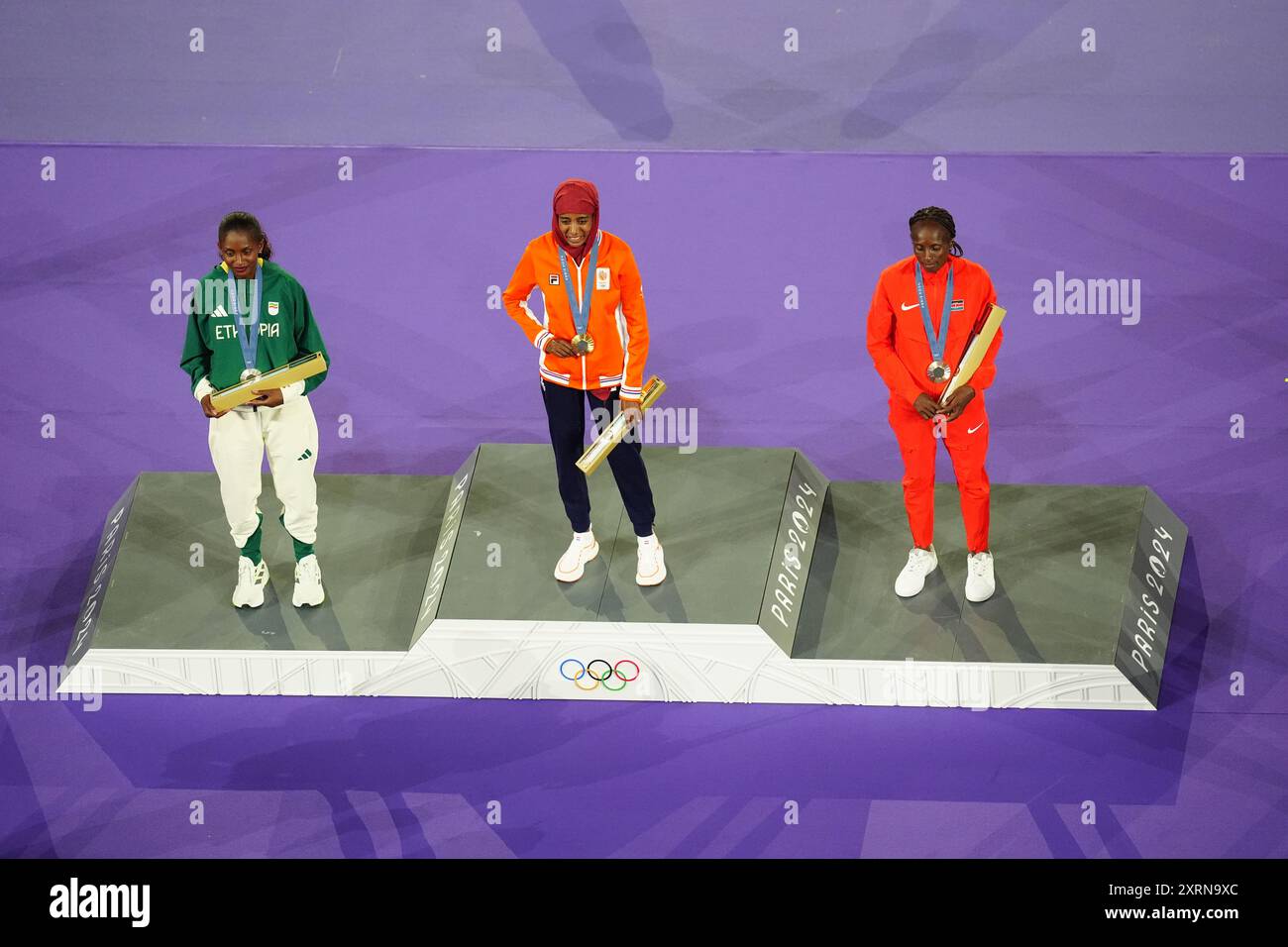 Netherlands' Sifan Hassan, gold medal winner (centre)Ethiopia's Tigst ...