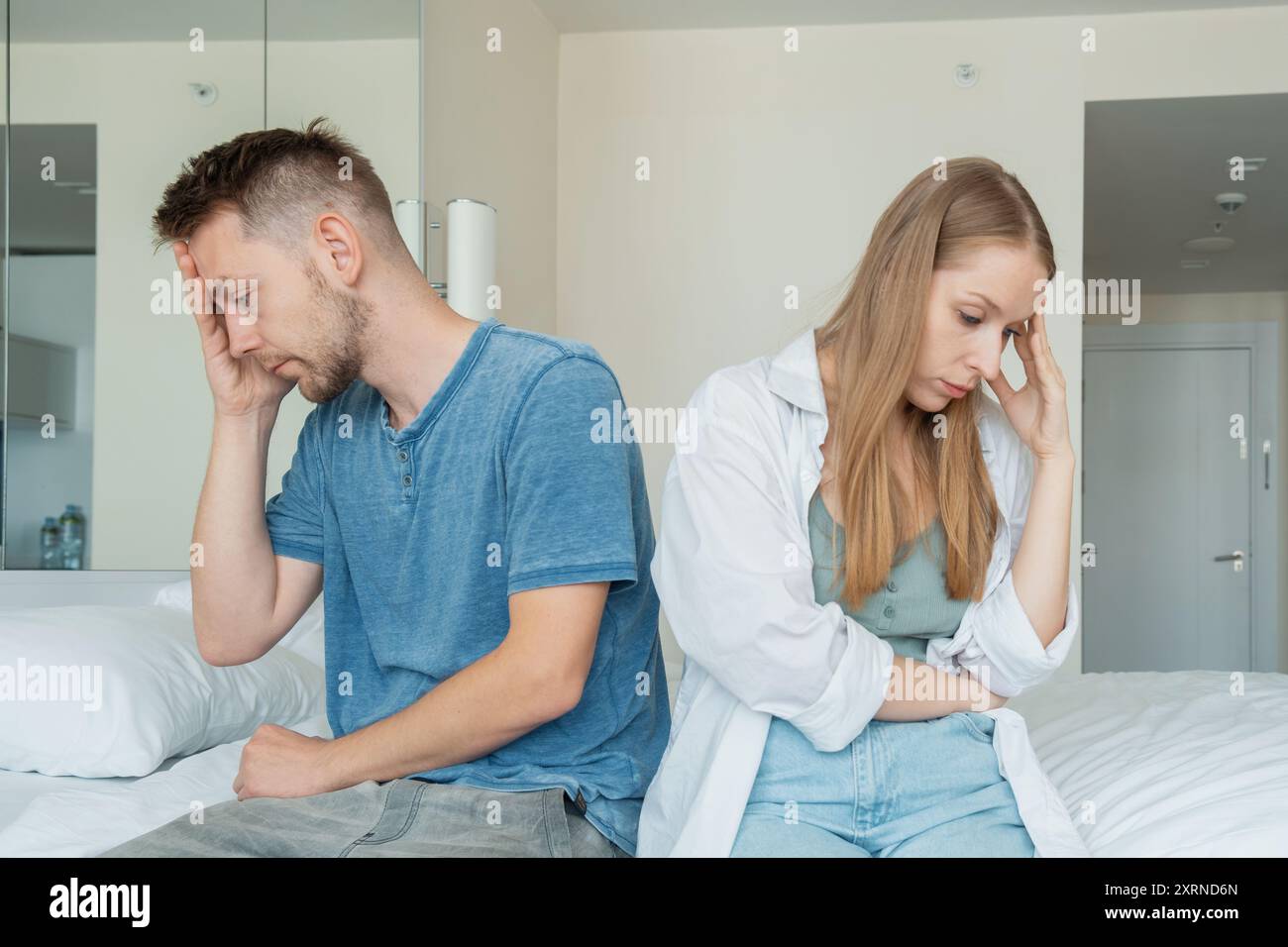 Unhappy couple in argument with disappointed woman and sad man sitting ...