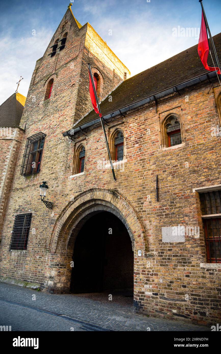 Gothic architrave entrance to St. John's Hospital in Bruges, Belgium ...