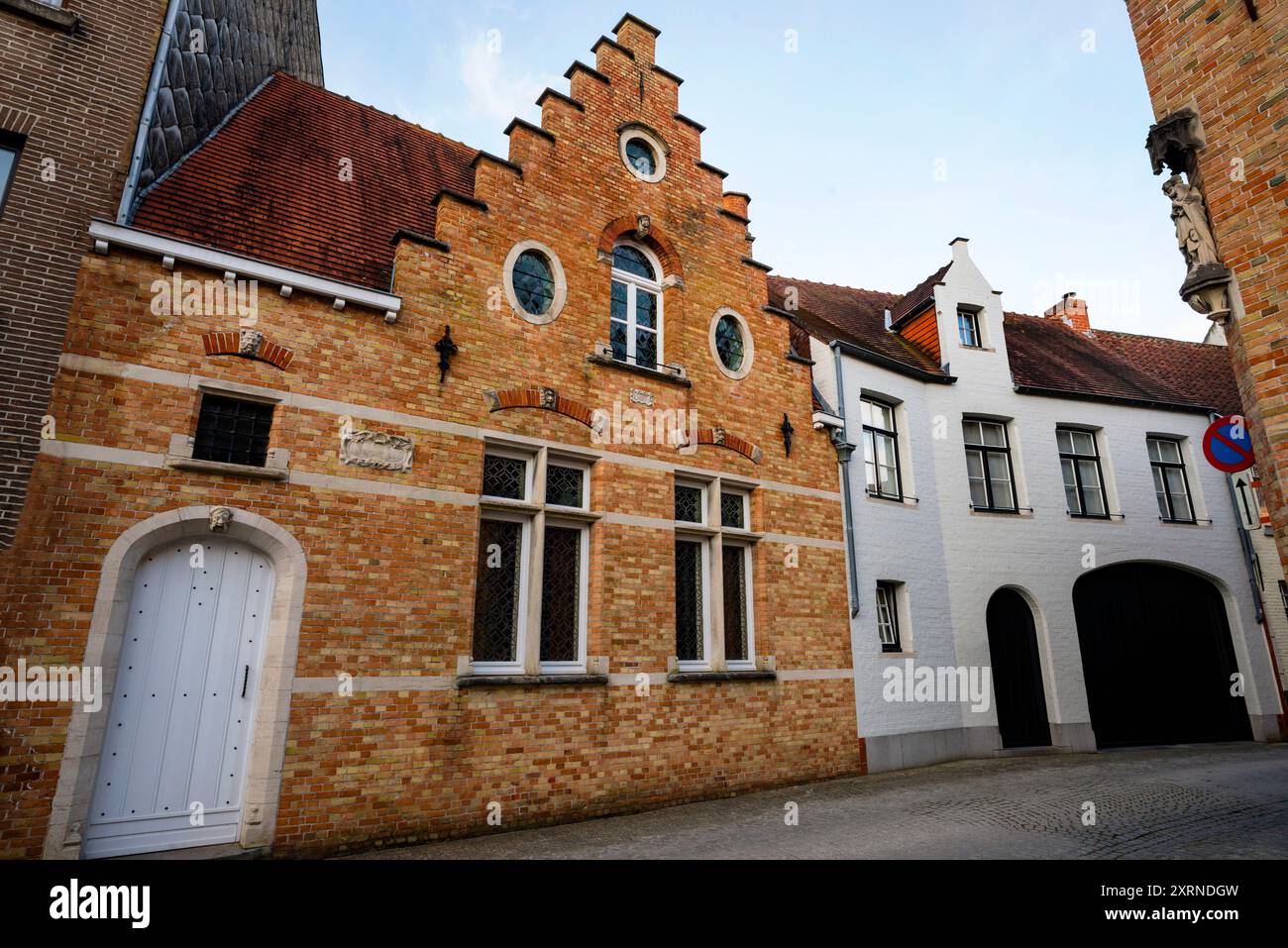 Flemish brick stair-step gable and Gothic baldachin in Bruges, Belgium ...