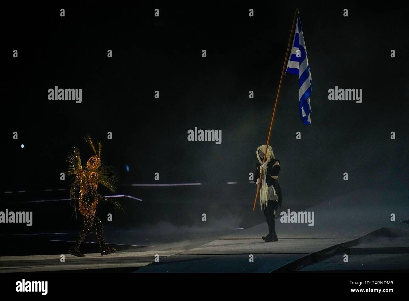 The Greek flag is carried onto the stage during the 2024 Summer ...