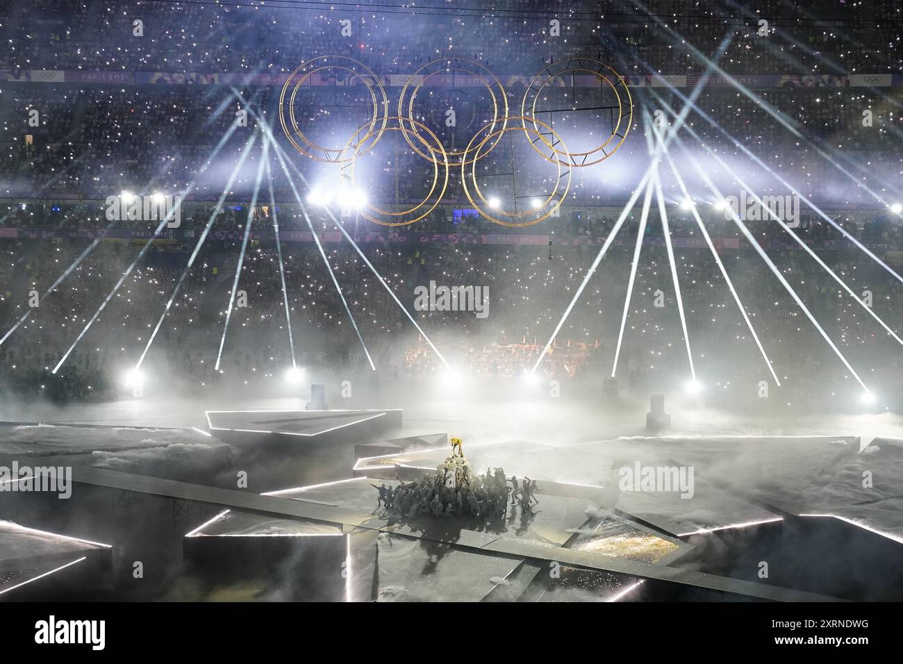 The Olympic Rings are formed during a performance at the closing ...