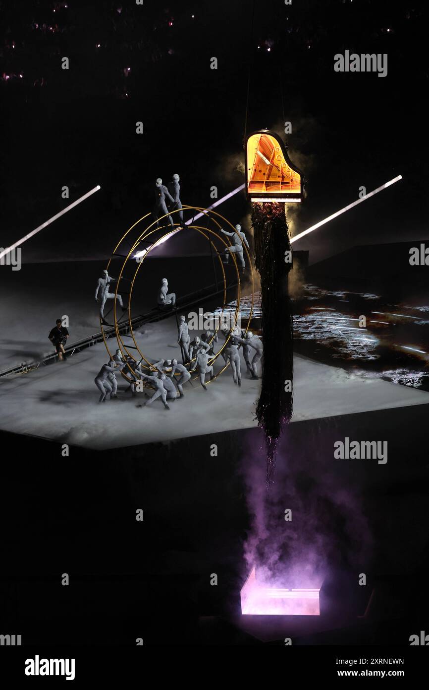 Paris, France. 11th Aug, 2024. Artist Alain Roche plays a piano during ...