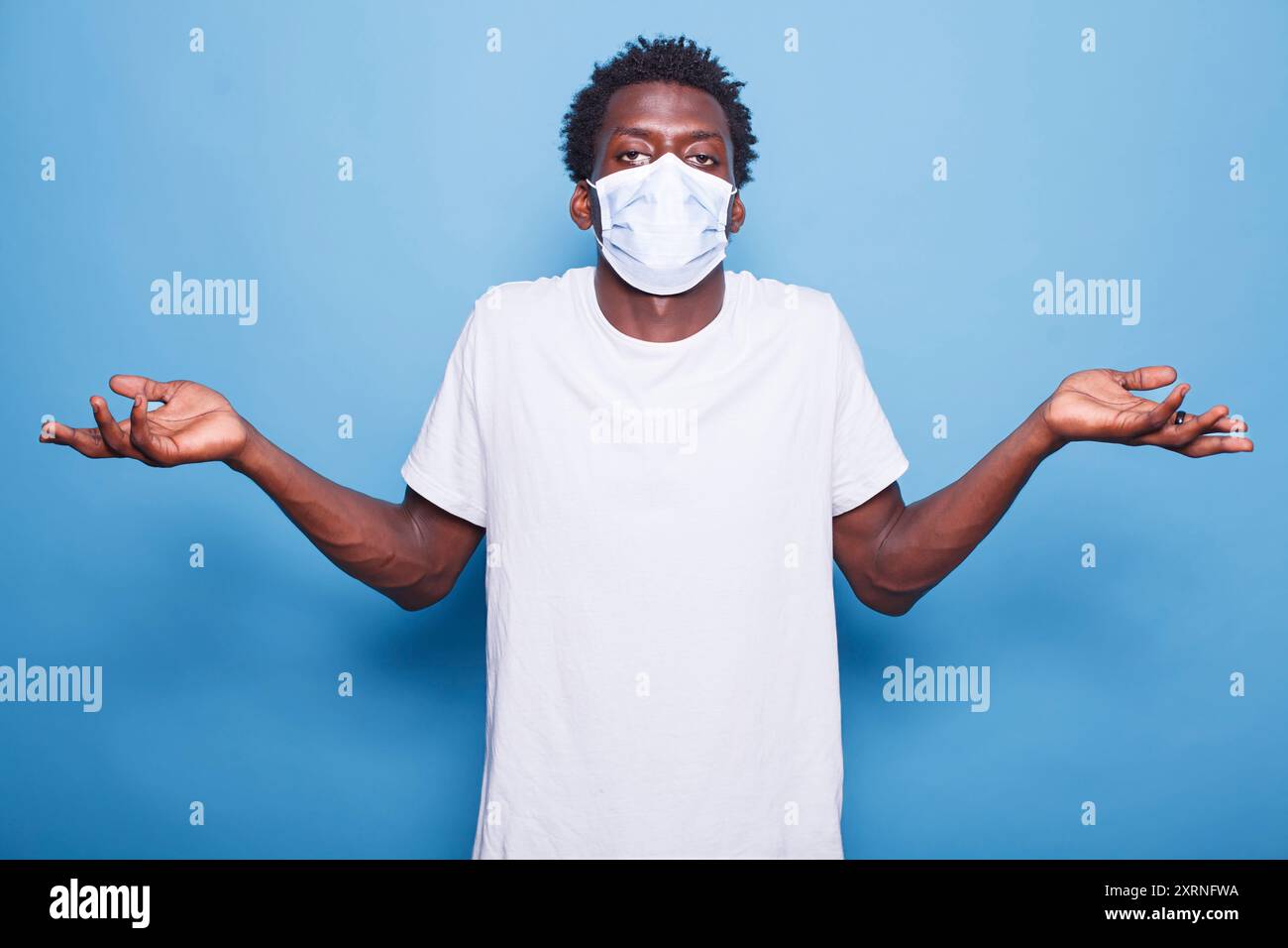 Bewildered person stands arms hi-res stock photography and images - Alamy
