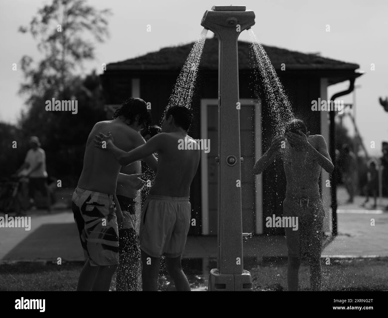 Boys showering on the beach in Malmö, Sweden Stock Photo - Alamy