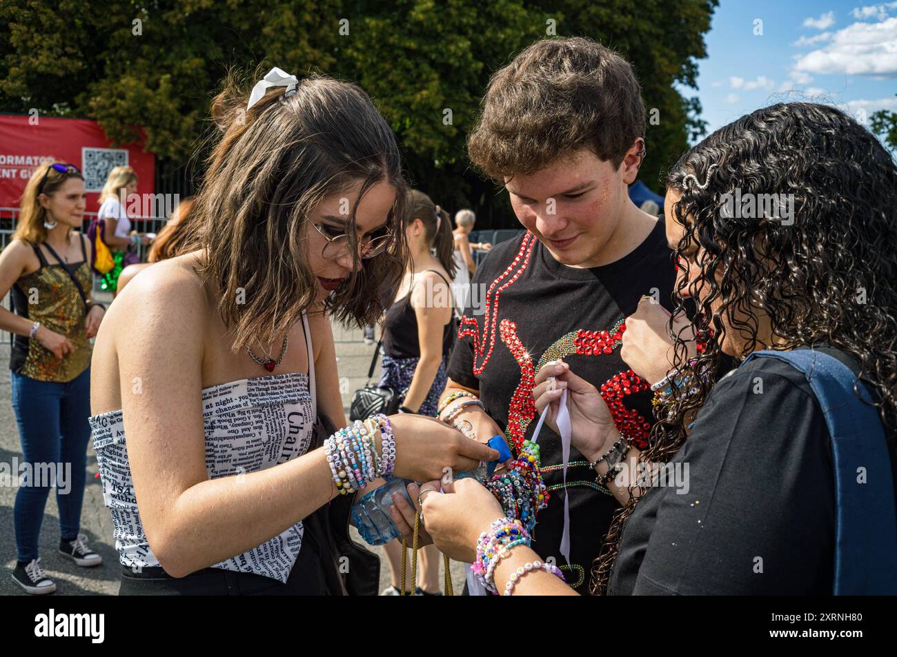 Taylor Swift fans swap friendship bracelets before the concert. Between ...