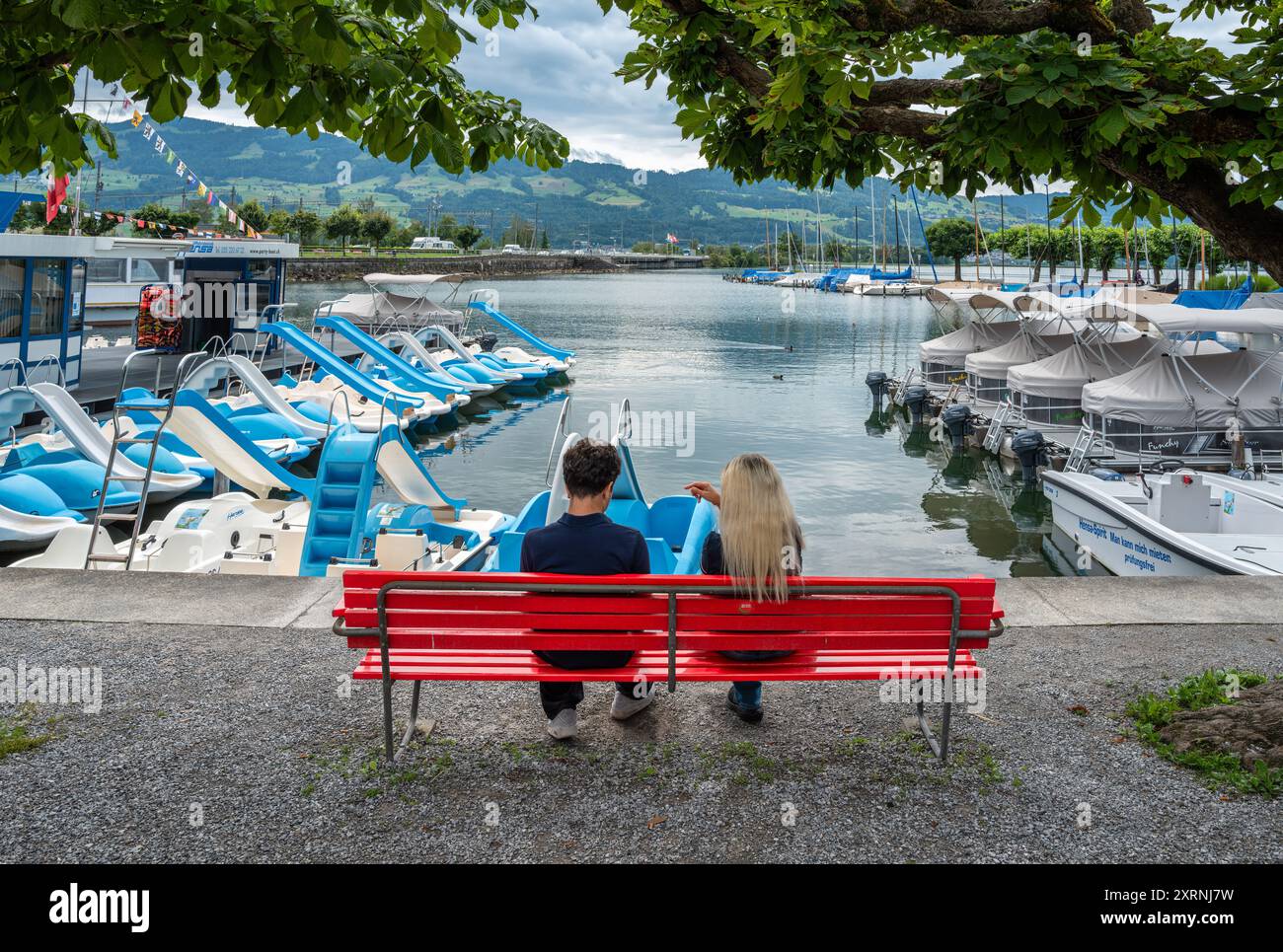 Rapperswil, Switzerland - July 1, 2024: A Man and woman sitting on a ...