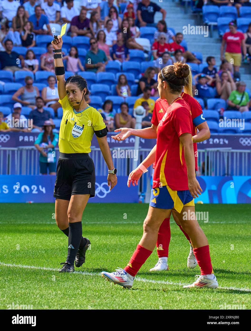 referee Katia Gercia (MEX) shows the Yellow Card to Cata Coll ...