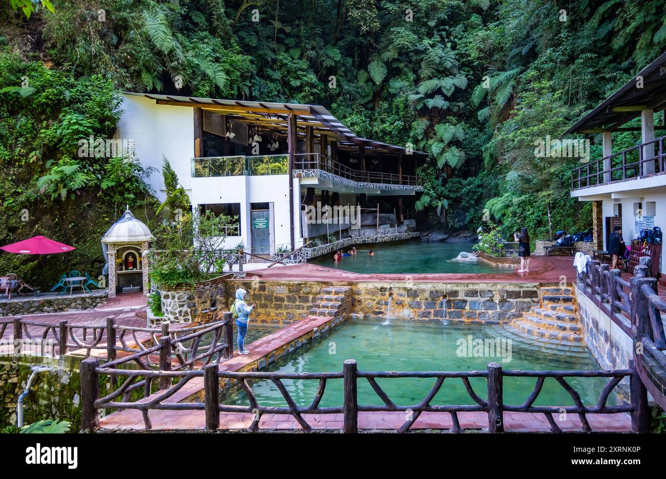 Visitors enjoying pools fed by hot springs at Fuentes Georginas ...