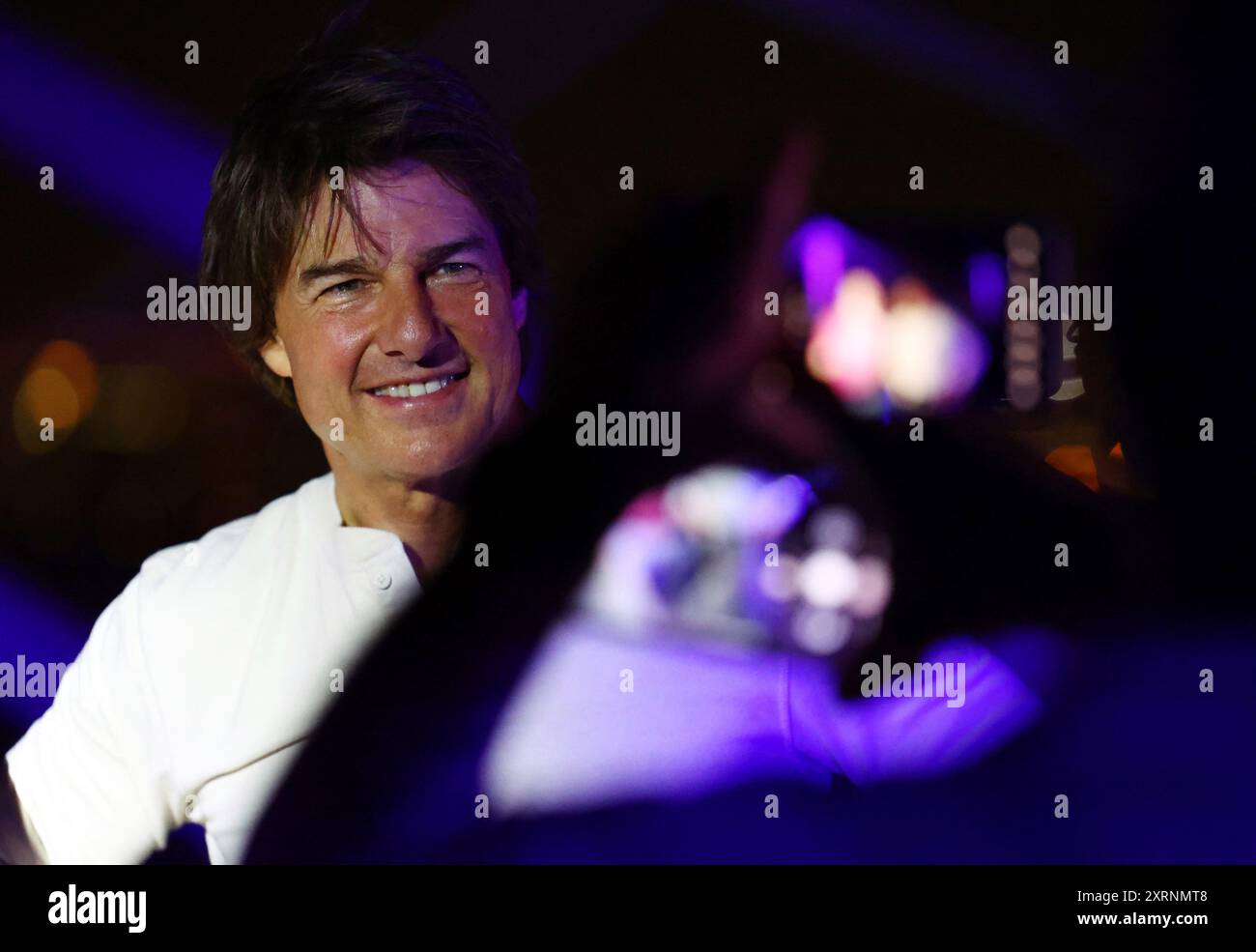 Actor Tom Cruise is photographed on the roof of the Stade de France ...