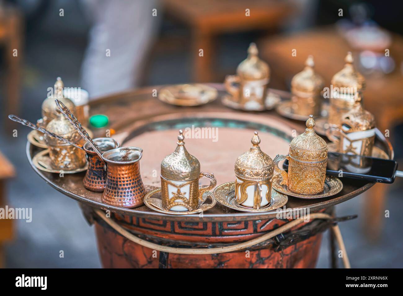 Set of traditional Turkish coffee cups and pots on tray, intricate gold ...