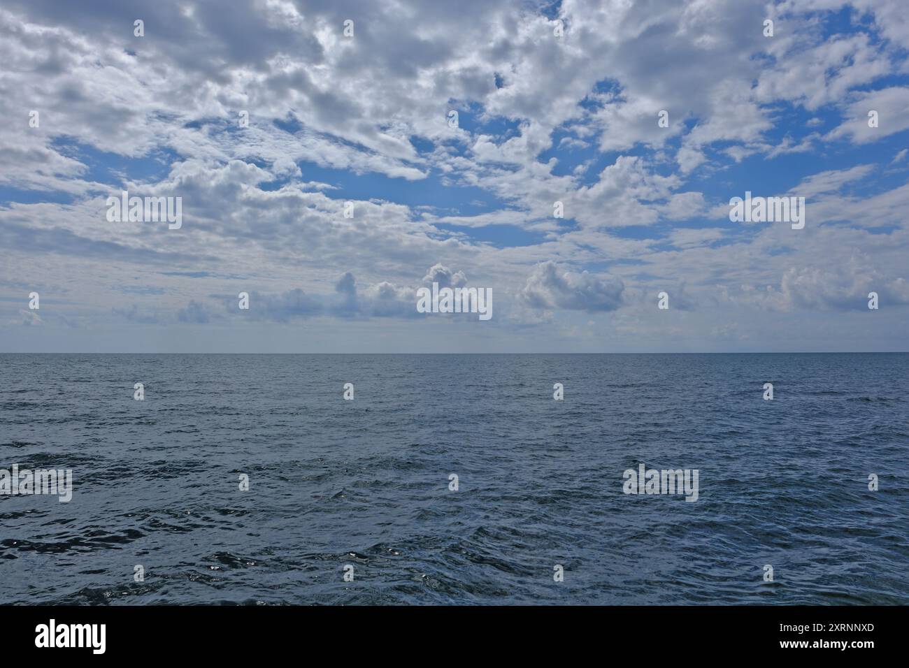 Blue sky with white clouds over beach hi-res stock photography and ...