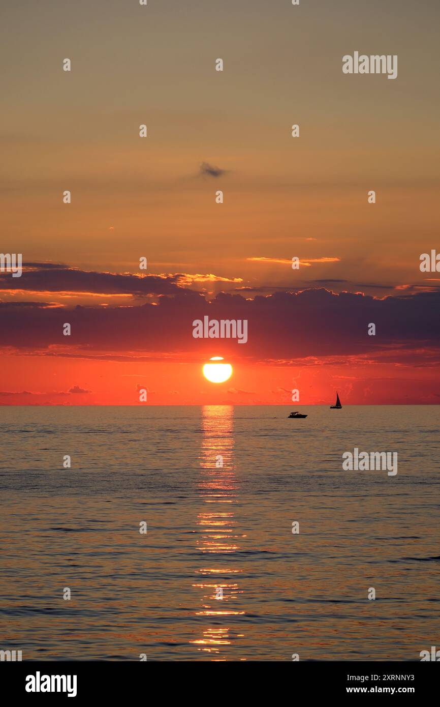 Sunset over boat on sea hi-res stock photography and images - Alamy