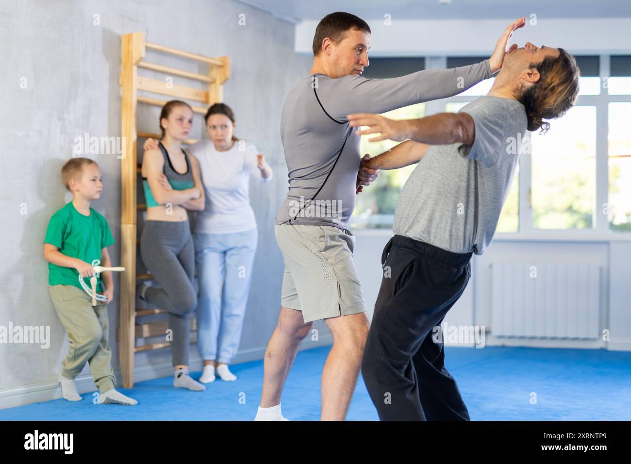 Man in gym perform basic elements of krav maga self-defense system ...