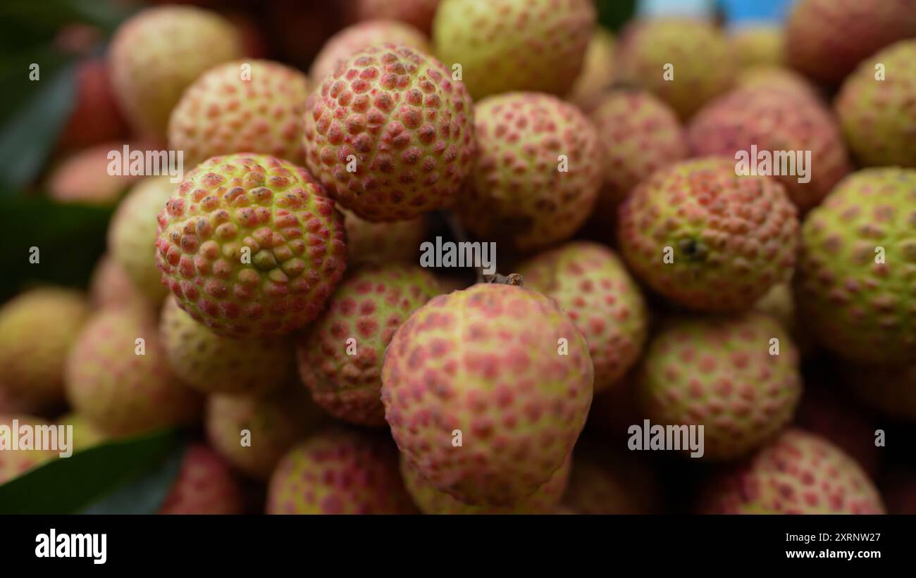 Ripe lychees, ready for sale at the market. Vibrant colors and juicy ...