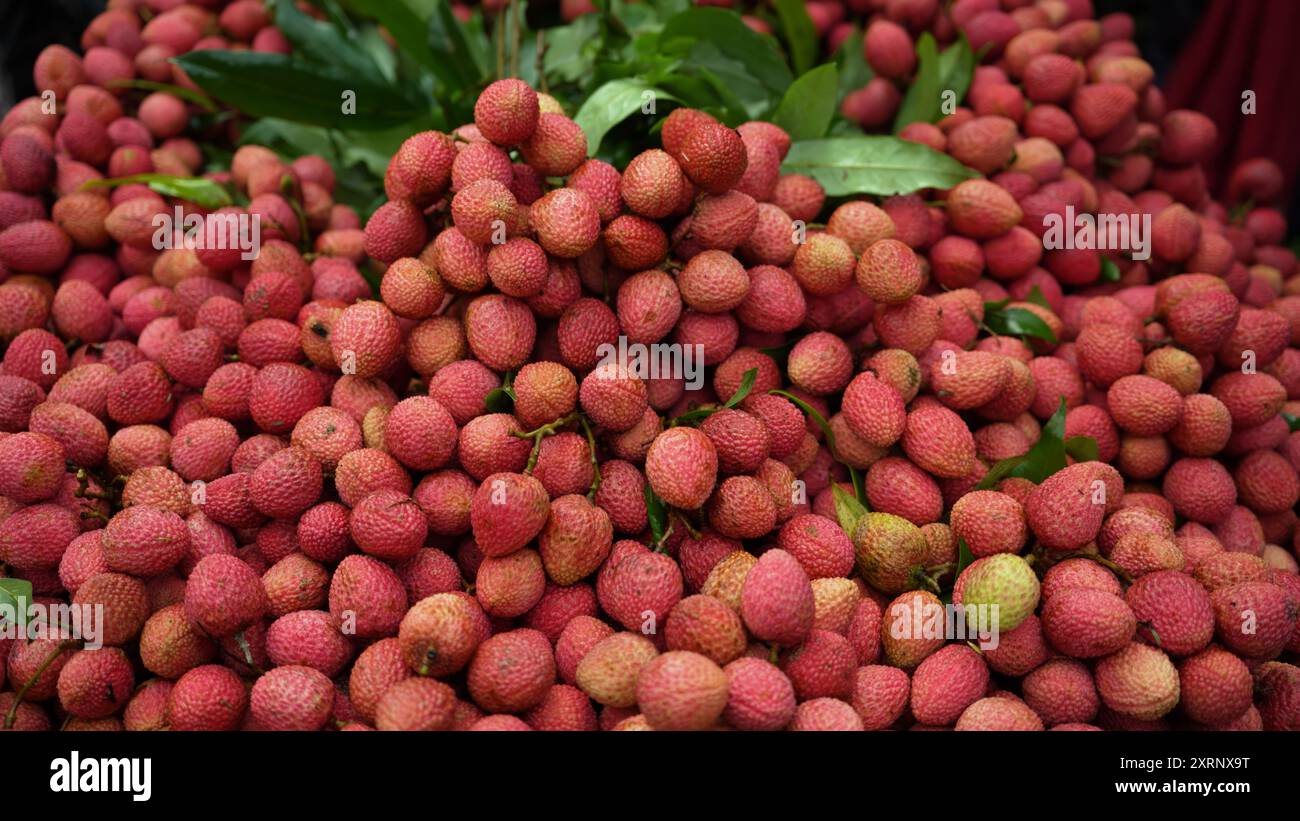 Ripe lychees, ready for sale at the market. Vibrant colors and juicy ...