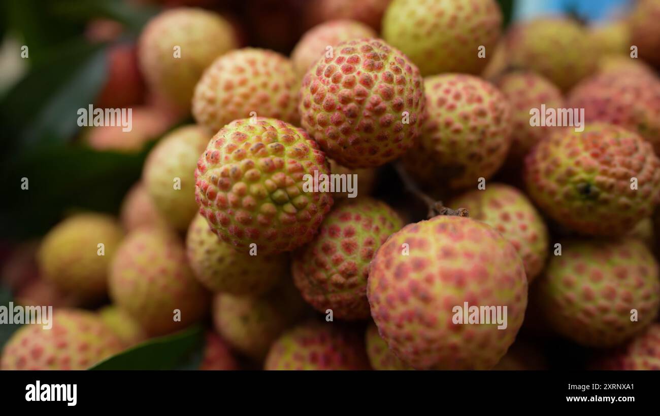 Ripe lychees, ready for sale at the market. Vibrant colors and juicy ...