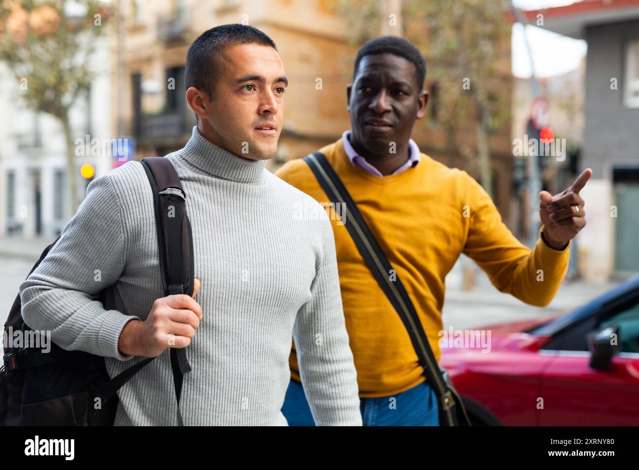 Men walking through city streets Stock Photo - Alamy