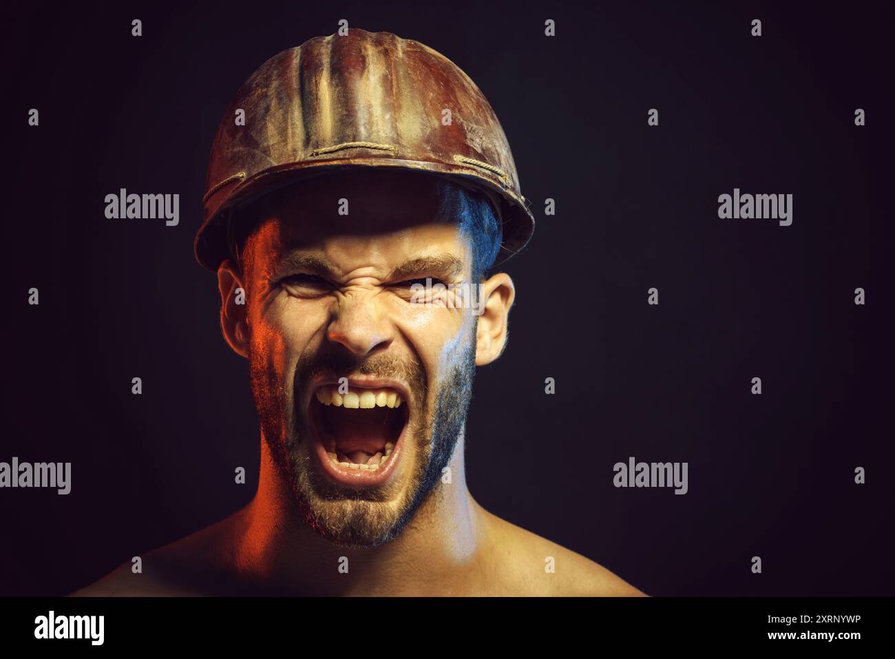 Builder man. Portrait of screaming builder in protective hard hat ...