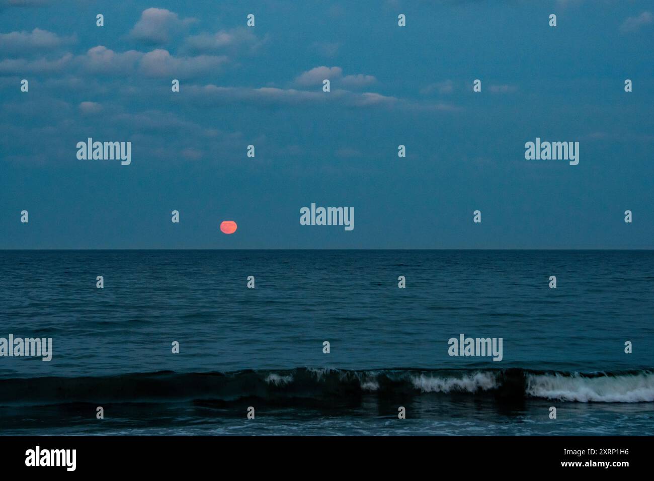 Full moon rises over the Atlantic Ocean Stock Photo - Alamy
