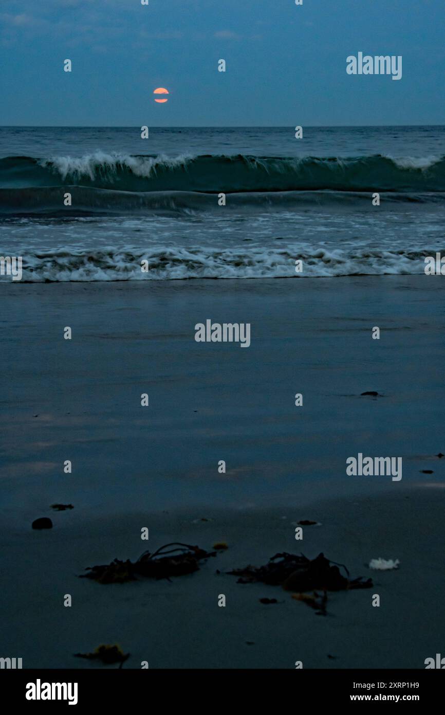 Full moon rises over the Atlantic Ocean Stock Photo - Alamy