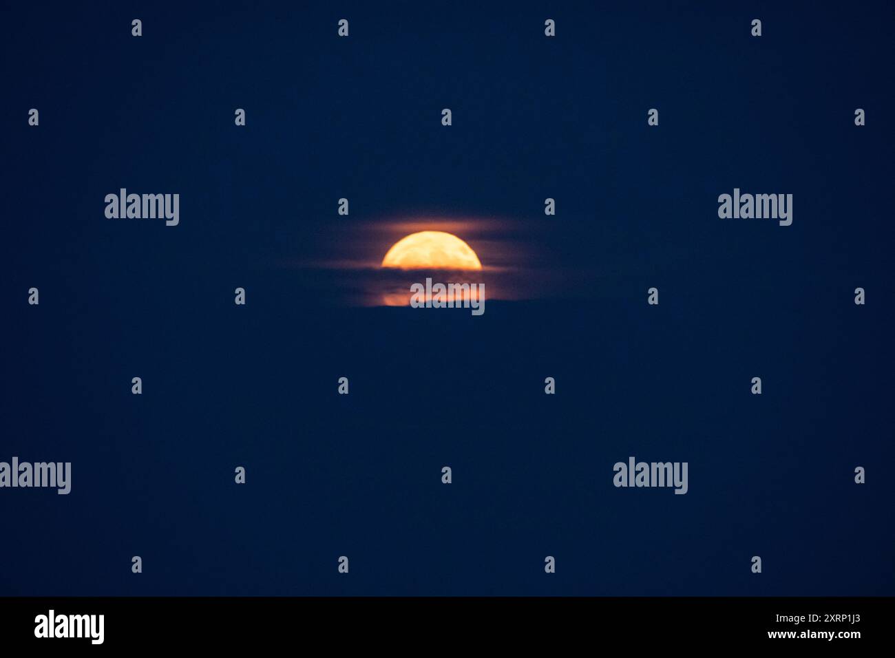 Full moon rises over the Atlantic Ocean Stock Photo - Alamy