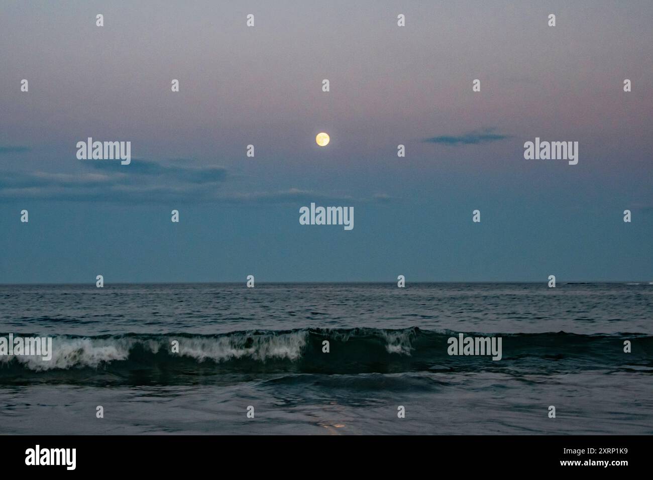 Full moon rises over the Atlantic Ocean Stock Photo - Alamy